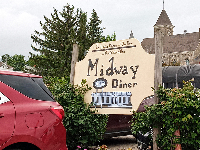 More than just a sign—it's a landmark that promises good food and better company, standing sentinel outside this beloved local institution.