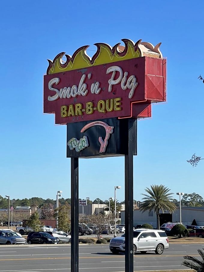 The vintage sign promises smoky delights ahead. Like a BBQ bat signal calling hungry heroes from miles around.