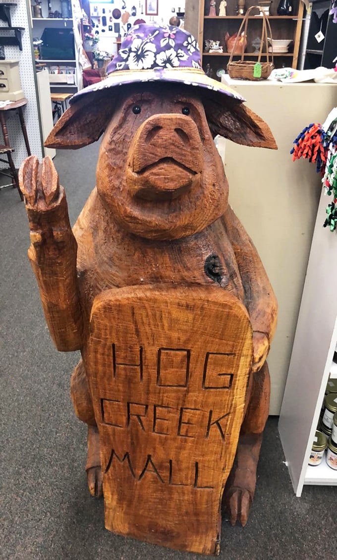The unofficial greeter of Hog Creek—a wooden pig with more personality than most reality TV stars and a hat that's surprisingly fashion-forward.