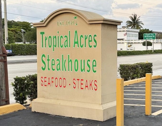 The roadside sign proudly announces "EST. 1949"—a testament to staying power in a region where restaurants often disappear faster than an ice cube in August.