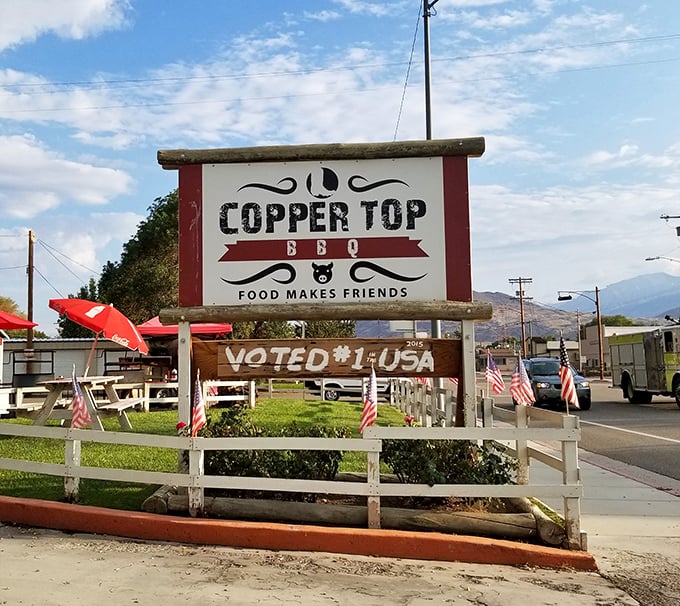 The sign proudly proclaims what locals already know – this unassuming roadside spot serves up some of America's most celebrated barbecue.