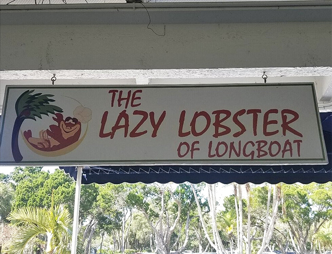 The sign features a cartoon lobster living its best life—a perfect mascot for a place that understands good food should be enjoyed, not just photographed.