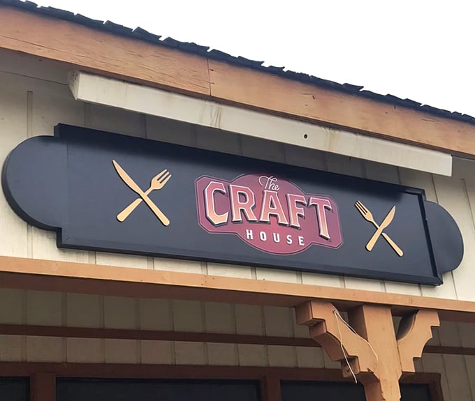 That sign isn't just announcing a restaurant; it's promising an experience. The crossed utensils are practically crossing their hearts.