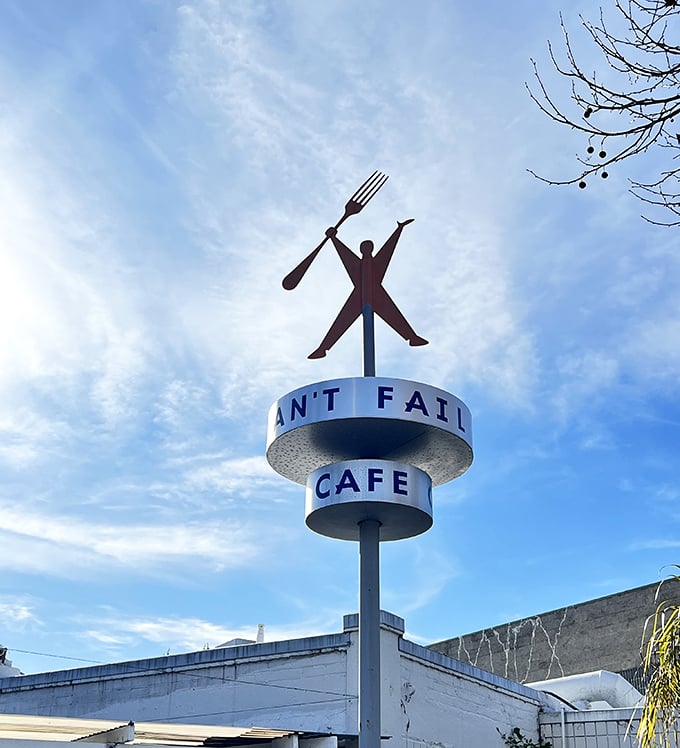 The iconic fork-wielding figure atop Rudy's sign stands triumphant against the sky—a monument to the eternal victory of good diners everywhere.