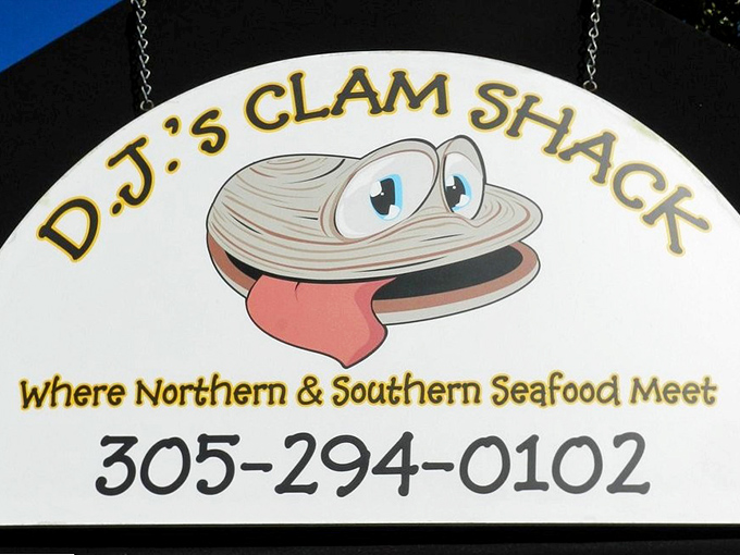 That cartoon clam isn't just cute—he's the smiling harbinger of the seafood joy that awaits inside. Follow him to happiness.