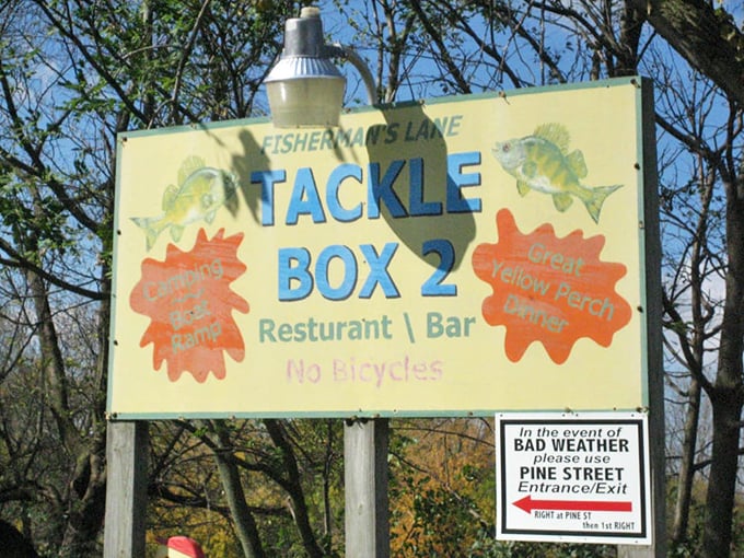 The sign promises "Great Yellow Perch" and "Famous Walleye"—two promises Tackle Box 2 keeps with delicious dedication. 