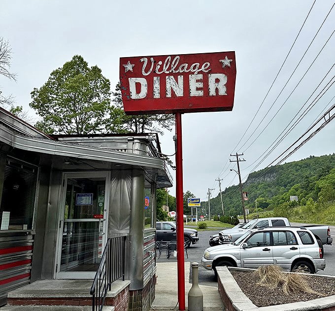 That iconic sign against the Pocono mountains backdrop tells you everything: authentic diner experience ahead, no GPS required.