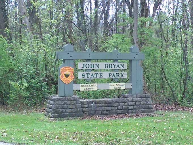 The park entrance sign welcomes visitors with classic state park charm—sturdy, straightforward, and promising adventures beyond the parking lot.