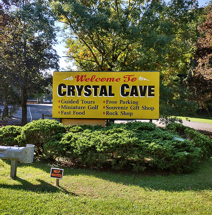 The welcoming sign promises guided tours and miniature golf – because why choose between underground wonders and surface fun?
