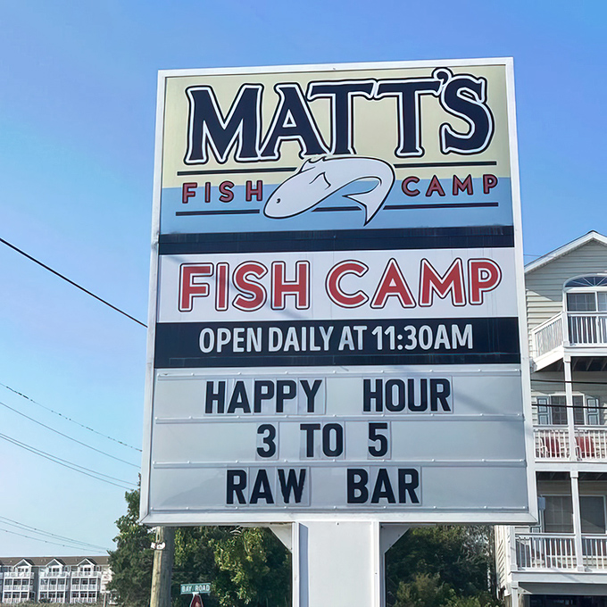 The roadside marquee that stops traffic with three magic words: "HAPPY HOUR" and "RAW BAR"—a siren call no seafood lover can resist.