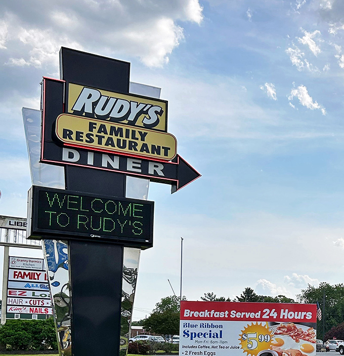 That classic roadside sign—part lighthouse, part promise—guiding hungry travelers to the 24-hour breakfast paradise they didn't know they needed.