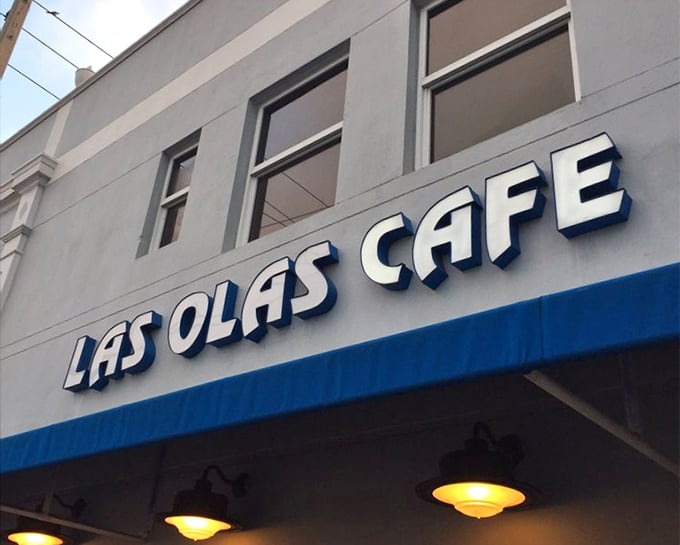 The blue and white signage promises little but delivers everything—like finding a Picasso at a yard sale.