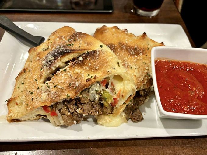 This isn't just a stromboli—it's a masterclass in the art of stuffing delicious things inside bread and making it look effortless.