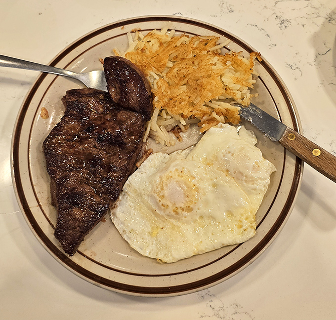 The classic steak and eggs—proof that breakfast can be dinner and dinner can be breakfast. This plate doesn't just cross mealtime boundaries—it abolishes them completely.