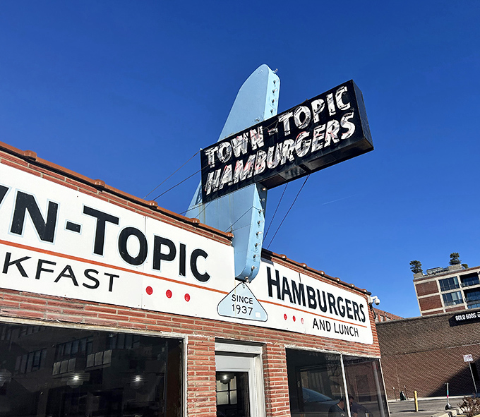 That blue arrow sign has been pointing the way to burger bliss for generations, a beacon of hope for the hungry across Kansas City.