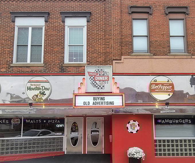 The storefront proudly announces its dual citizenship in the kingdoms of diner fare and pizza perfection, with vintage soda signs serving as the royal coat of arms.