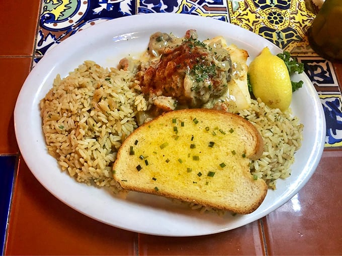 Seafood nestled against golden rice like it's found its forever home—comfort food that speaks fluent Floridian with a Gulf accent.