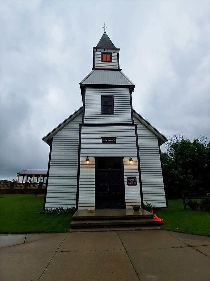 This charming white chapel stands as a reminder that small-town America still exists—where weddings are community events and everyone brings potato salad.