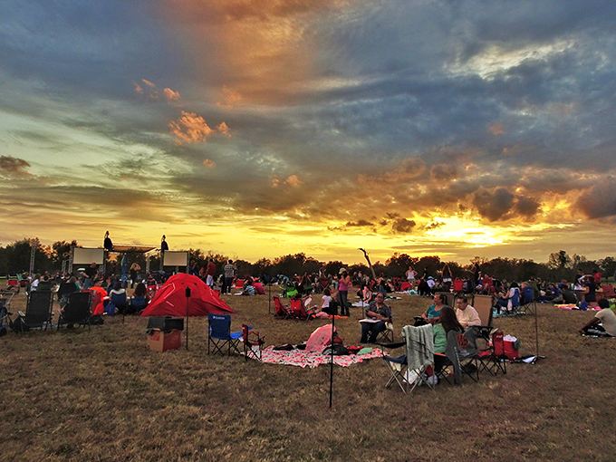 As the sun sets on an outdoor gathering, strangers become friends under a Florida sky that puts on its own spectacular show—no admission fee required.