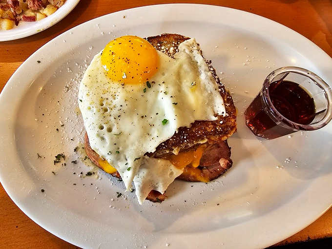 The Monte Cristo—where breakfast and lunch collide in a glorious stack of ham, cheese, and egg that makes you wonder why we separate meals at all.