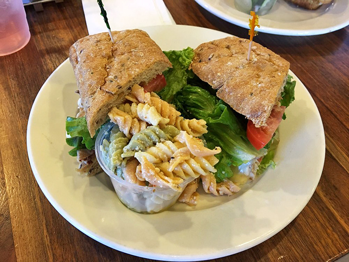This hearty sandwich on rustic bread, served with pasta salad, isn't just lunch—it's the midday vacation your workday desperately needs.
