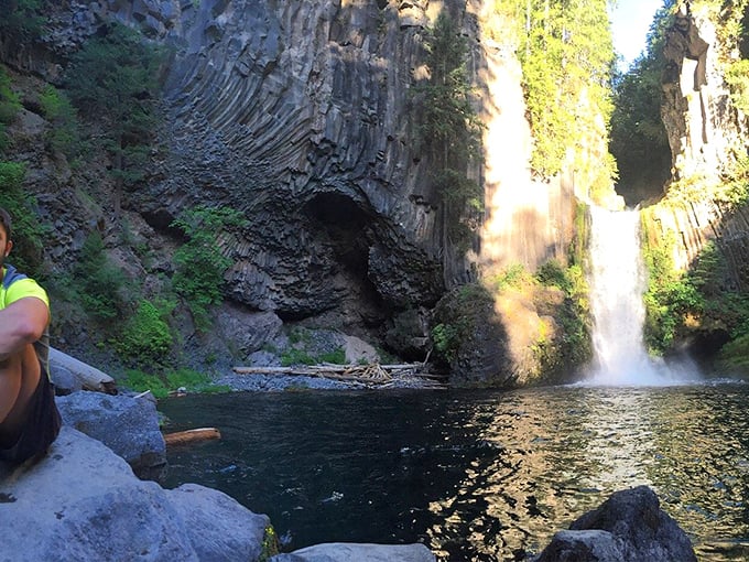 The payoff view! From this rocky perch, visitors witness the full dramatic performance of water, light, and ancient stone.