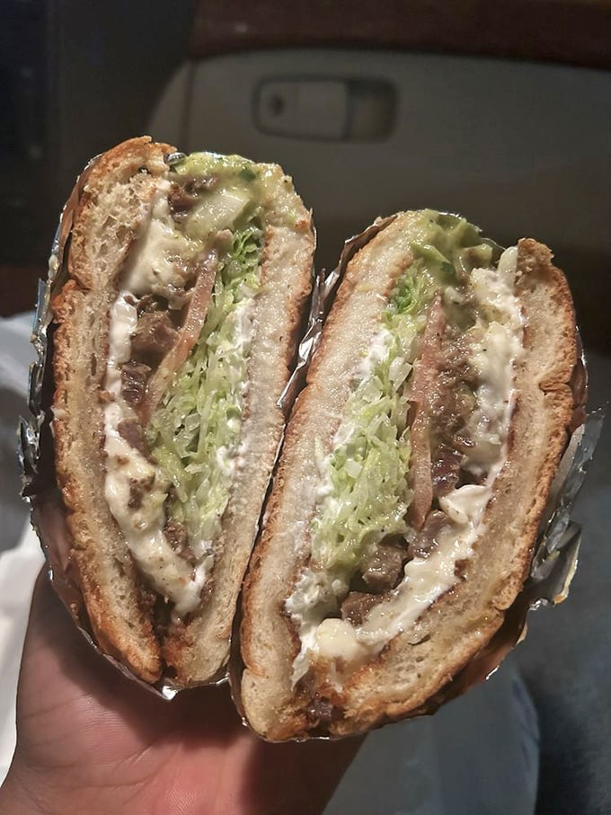 Not just a sandwich, but an engineering marvel. This torta packs an entire Mexican feast between two slices of bread—a portable flavor explosion.