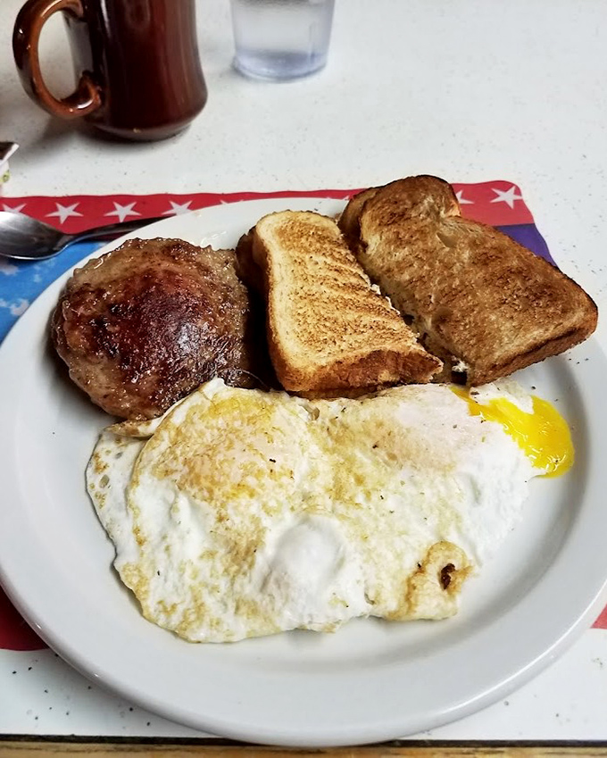 The classic American breakfast—eggs, toast, and sausage. Like a Norman Rockwell painting you can eat.