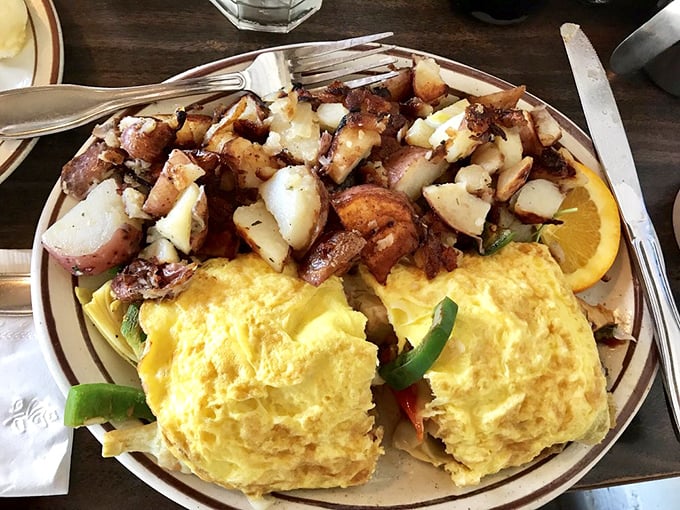 An omelet that's basically a vegetable delivery system disguised as comfort food. Paired with potatoes that have achieved crispy-on-the-outside, tender-inside perfection.