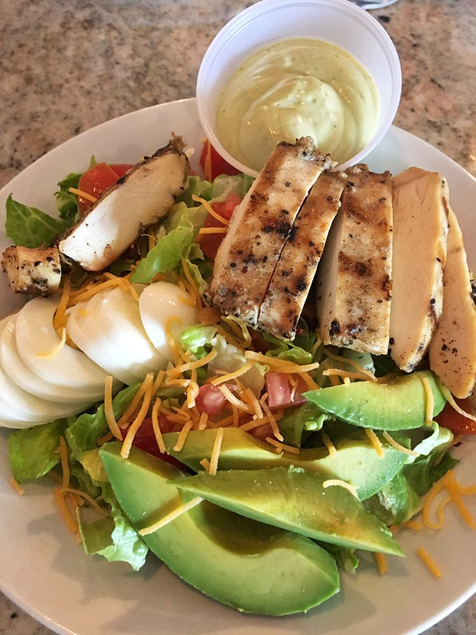A salad that doesn't feel like punishment. Avocado, chicken, and egg create the protein trifecta that makes healthy eating bearable.