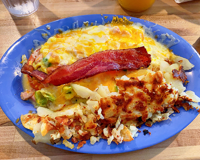 This Western omelet isn't just breakfast—it's an expedition across flavor country with that perfectly crispy hash brown coastline.