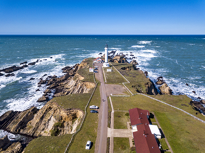 Bird's eye brilliance! This aerial view reveals what the seagulls have known all along—Point Arena Lighthouse sits on California's most dramatic stage.