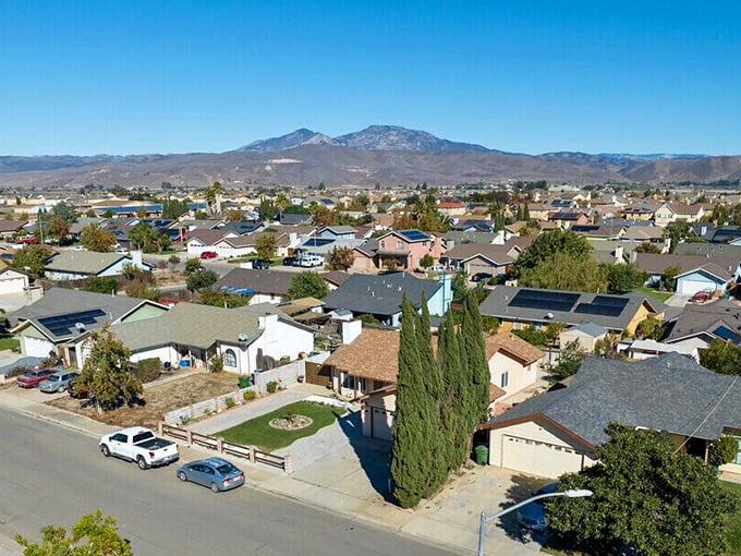 From above, Greenfield reveals its perfect placement—residential comfort nestled between mountain majesty and valley abundance.