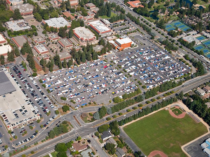 From above, the market resembles a colorful patchwork quilt spread across the campus. Each tiny square below represents someone's passion, livelihood, or decluttering mission.