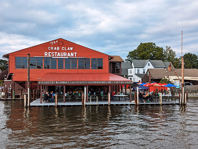 From the water, The Crab Claw looks like a red beacon of culinary hope, promising the kind of meal that makes memories last longer than sunburns.