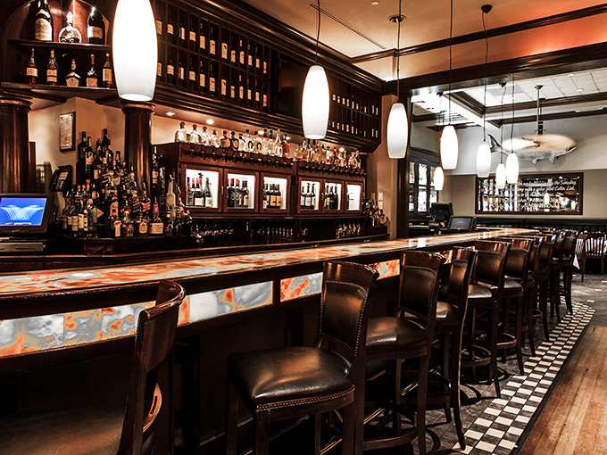 A bar that whispers "adult sophistication" while maintaining enough warmth to make you feel like the regular you've always wanted to be.