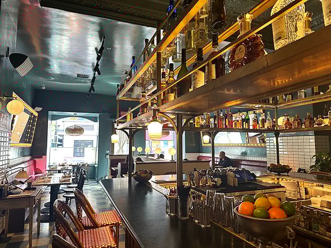 A bar that says, "Pull up a seat, we've been expecting you," with bottles standing like soldiers ready for your order.