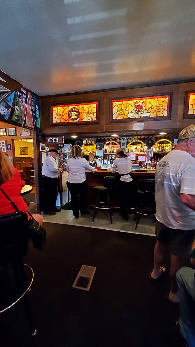 The bar area with stained glass windows feels like a secret club where everybody knows your name – or will by the end of the night.