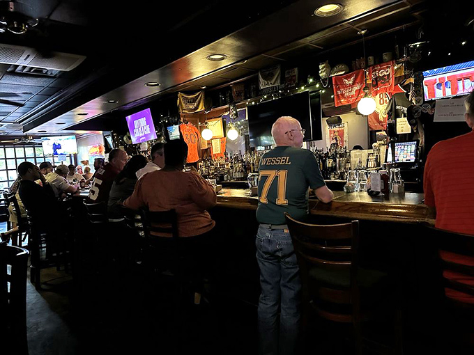 The beating heart of any good establishment—a bar where strangers become friends and sports jerseys are the unofficial dress code.