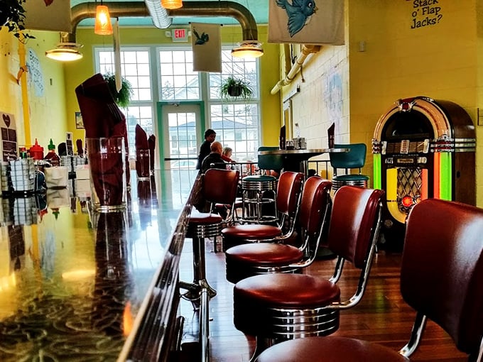 The counter seating isn't just functional—it's front-row tickets to the breakfast theater, complete with vintage jukebox ambiance.