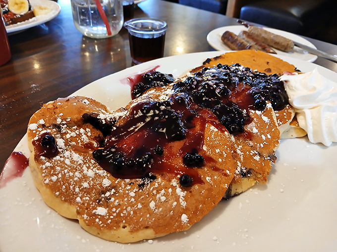 Blueberry pancakes swimming in warm compote—the breakfast equivalent of hitting the jackpot on your first pull of the slot machine.