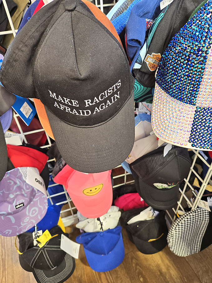 Even the hat selection makes a statement. In the world of secondhand fashion, personality isn't optional—it's the whole point.