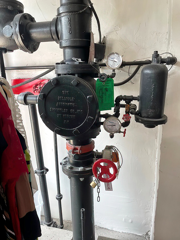 Even the industrial fixtures have character at Avalon Exchange—this vintage pipe system serving as both infrastructure and industrial chic decor. 