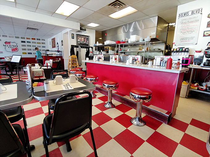 The counter seating offers front-row tickets to the breakfast ballet, where short-order cooks perform their morning choreography with practiced precision.