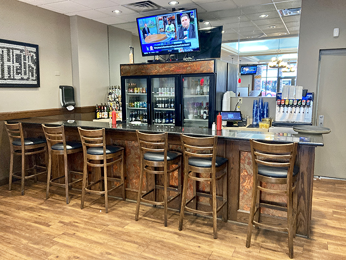The welcoming bar area offers a front-row seat to the action, where regulars exchange stories and newcomers quickly become friends.
