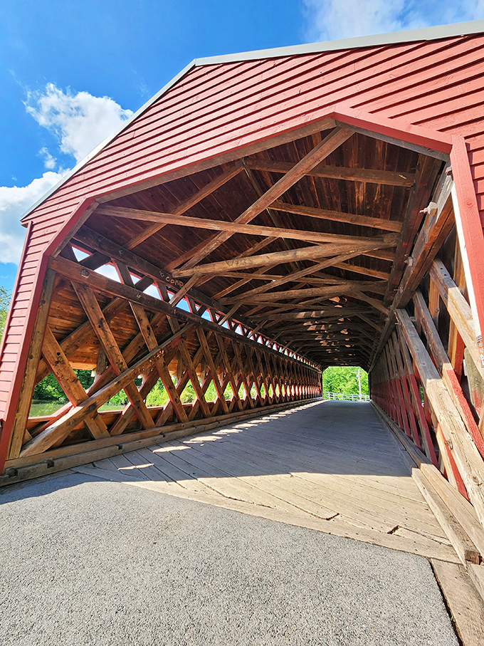 Sunlight creates mesmerizing patterns through the wooden lattice. Those diagonal beams aren't just pretty—they're an engineering marvel that's stood for generations.