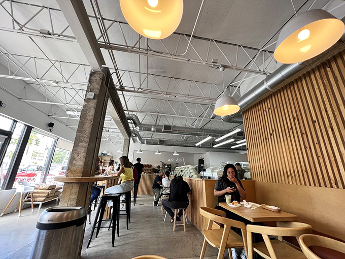 The modern, airy dining space at Caracas Bakery invites you to linger over coffee and pastries while contemplating a second round – resistance is futile.