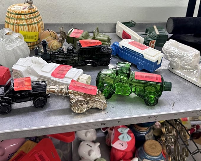 Tiny glass locomotives and decorative vessels line up like colorful candidates auditioning for roles as your next impulse purchase.