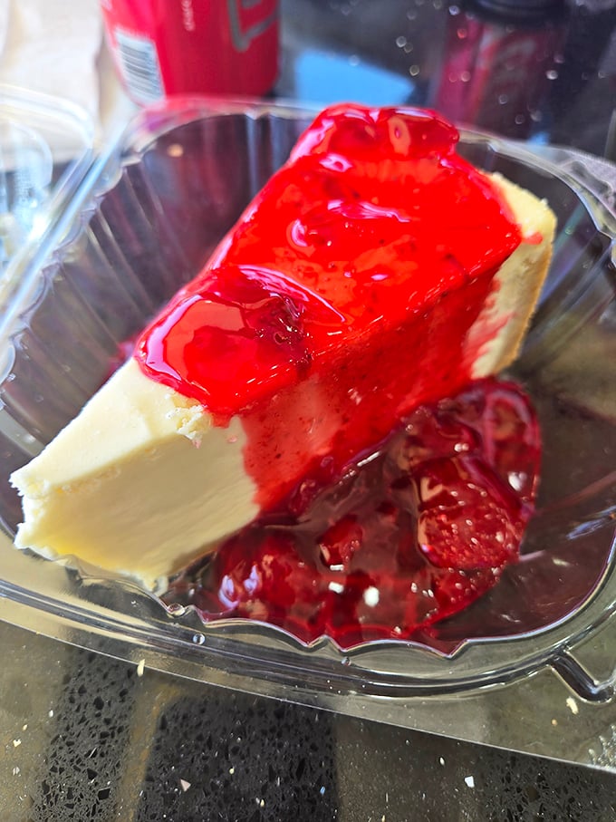 Cheesecake with strawberry topping that doesn't need to be on social media to know it's gorgeous—the kind of dessert that makes you forget about sharing.