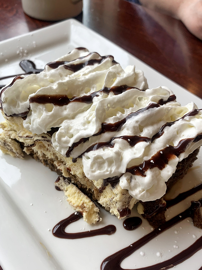 This isn't just dessert—it's therapy in tiramisu form, where layers of coffee-soaked goodness and whipped cream make all of life's problems temporarily disappear.